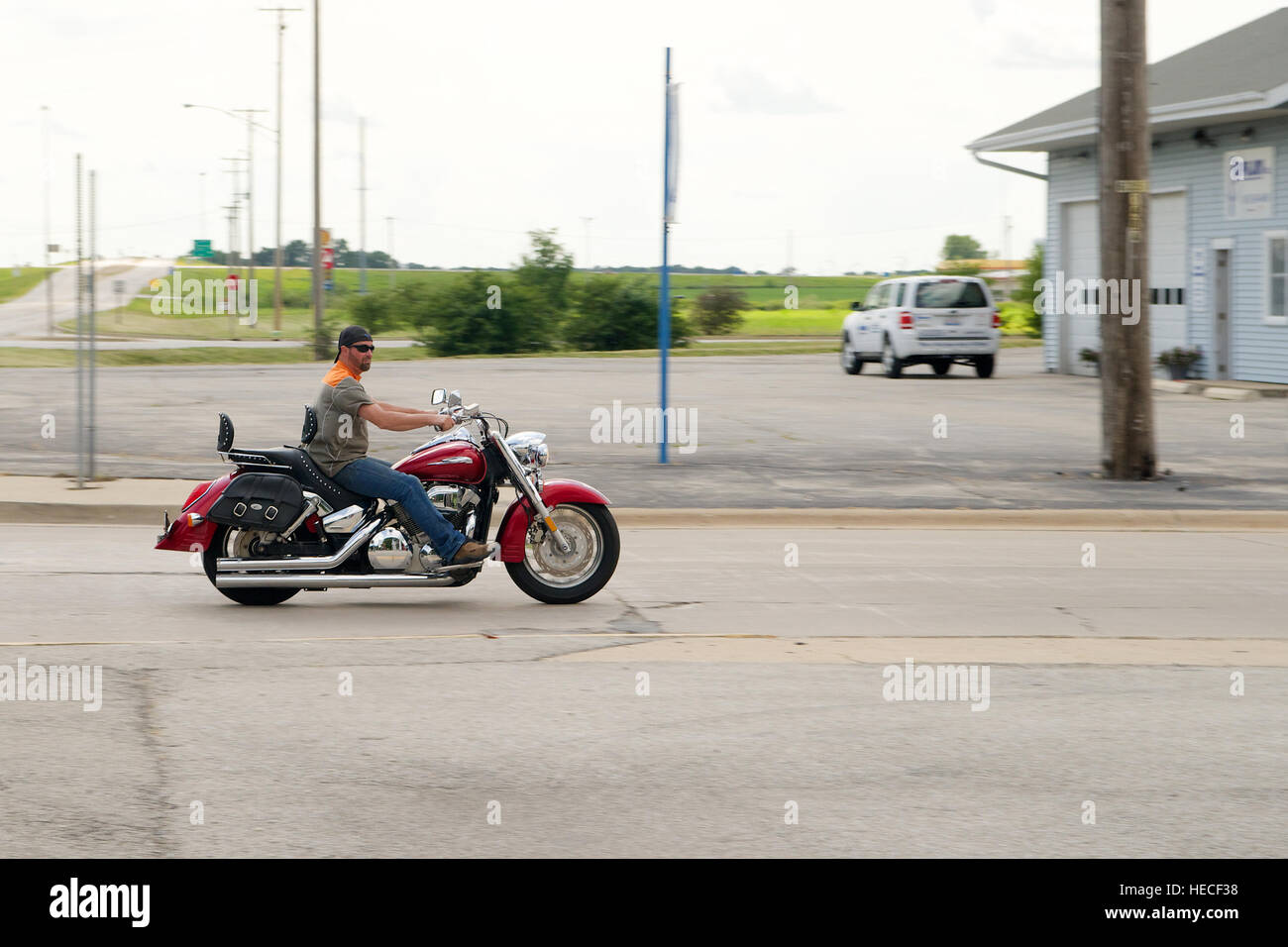 Man riding a Harley Davidson at the Intersection of Route 66 and ...