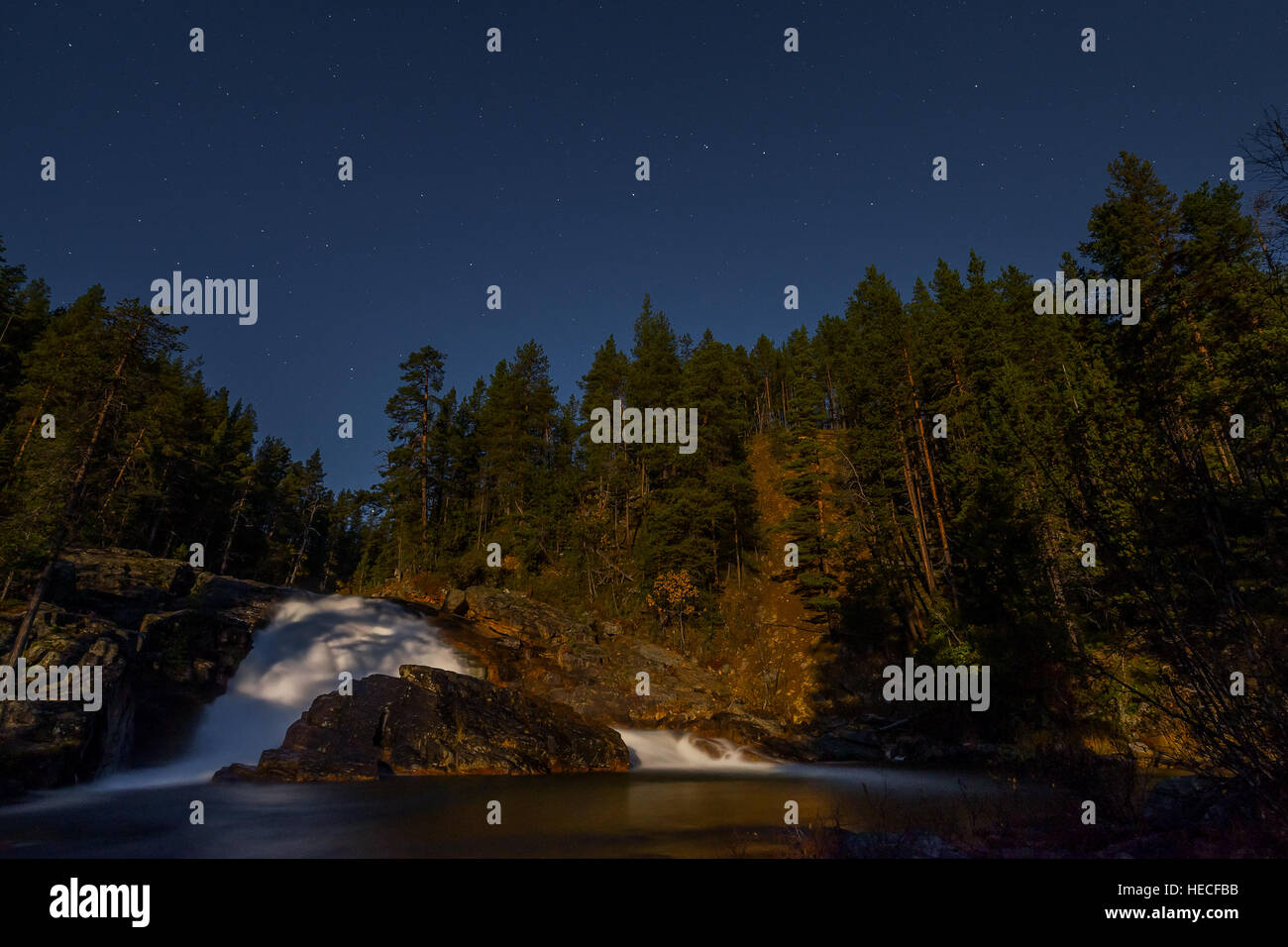 Waterfall in night landscape Stock Photo - Alamy