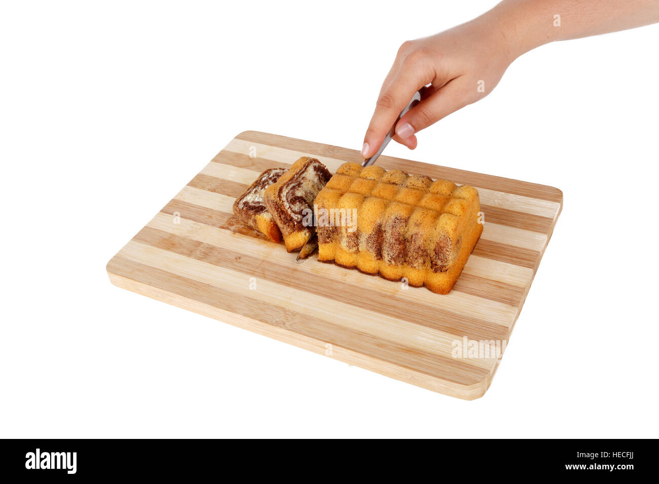 Close up detailed side view of cacao cake, woman hand slicing with a ...