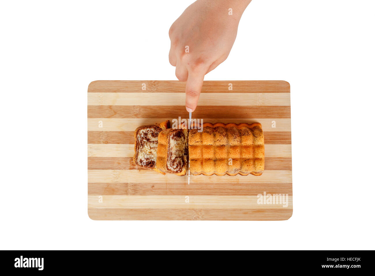 Close up detailed top view of cacao cake, woman hand slicing with a ...