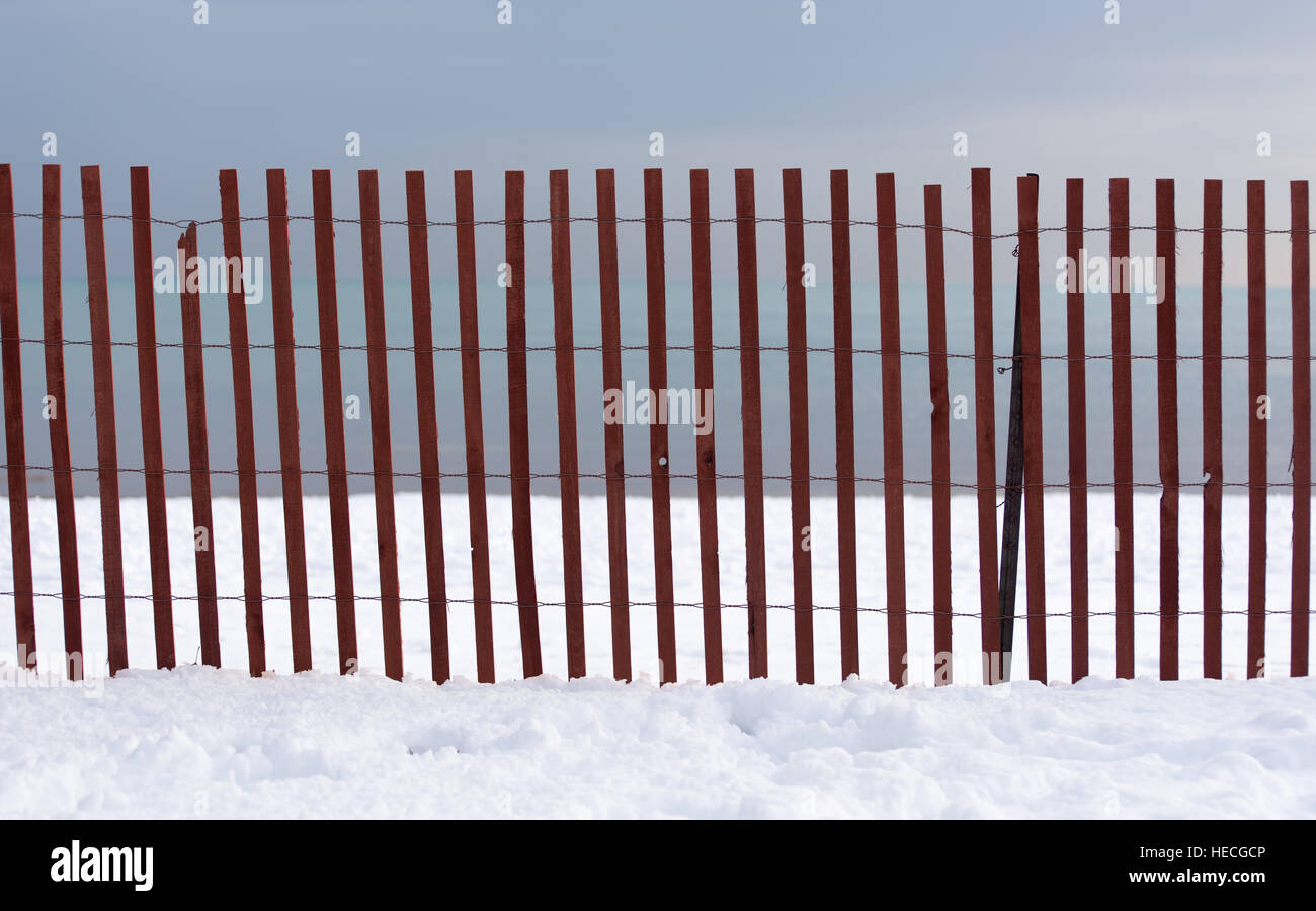 Fence on a lake Stock Photo - Alamy