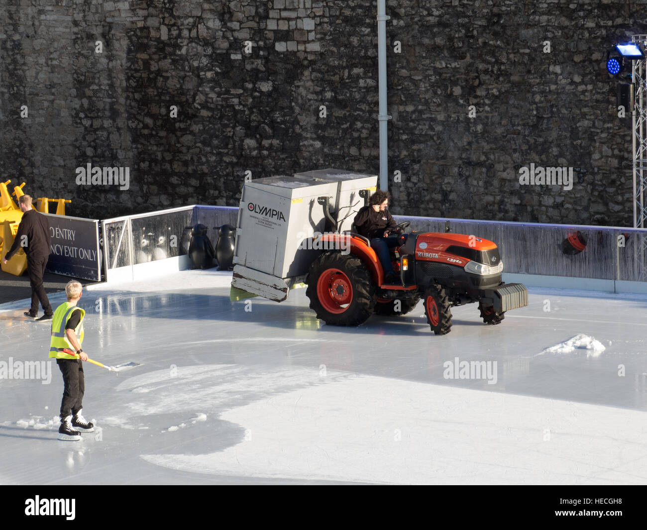 cleaning clearing ice rink tractor hopper crisp Stock Photo - Alamy
