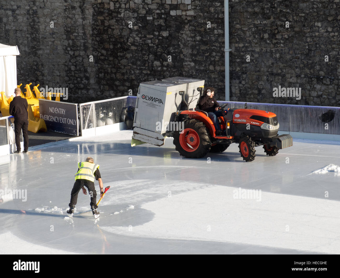 cleaning clearing ice rink tractor hopper crisp Stock Photo - Alamy