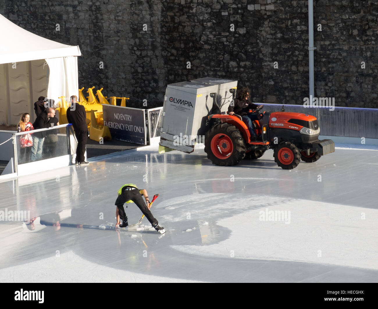 cleaning clearing ice rink tractor hopper crisp Stock Photo - Alamy