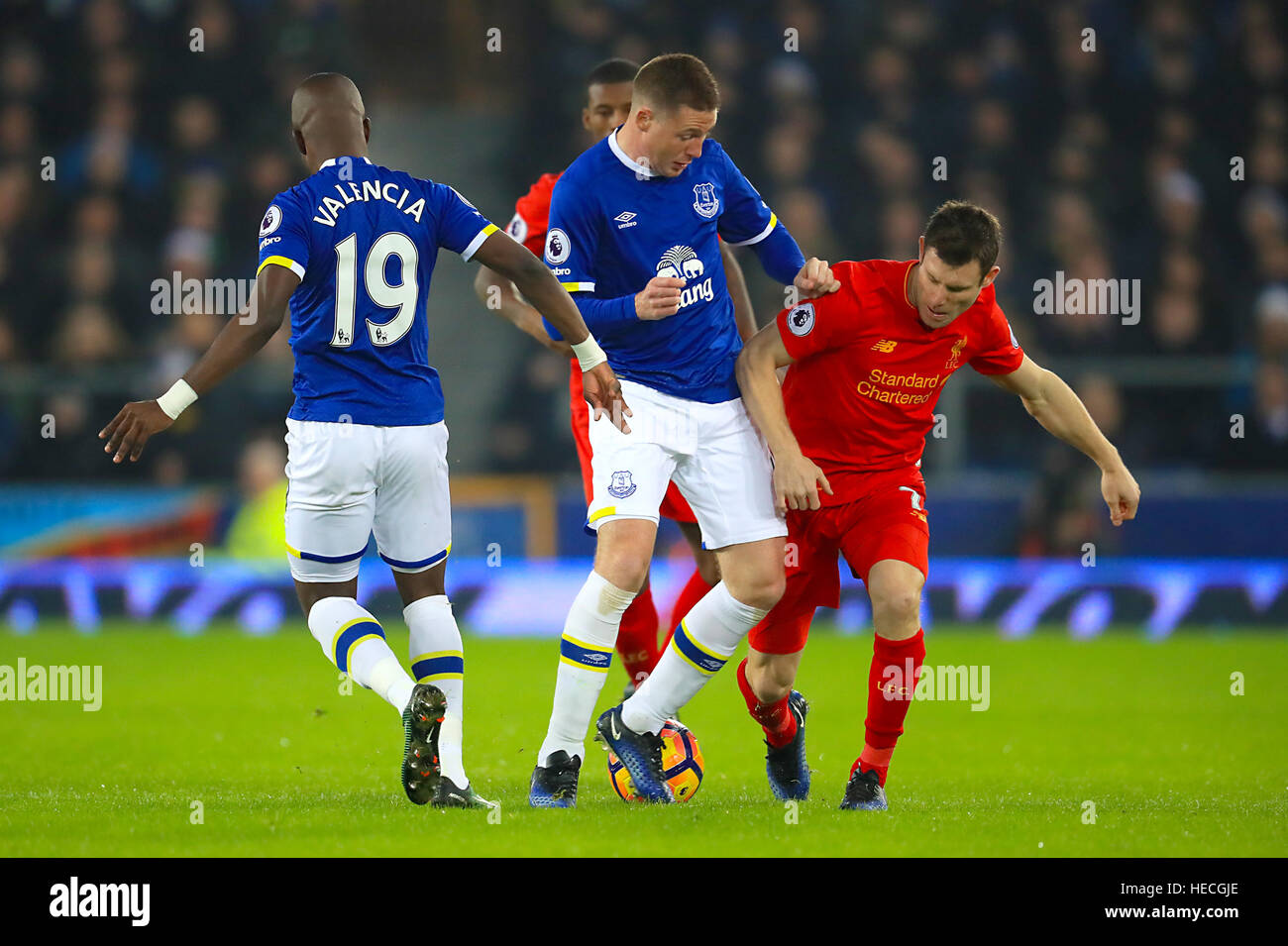 Everton's Enner Valencia and Ross Barkley (centre) battle for the ball ...