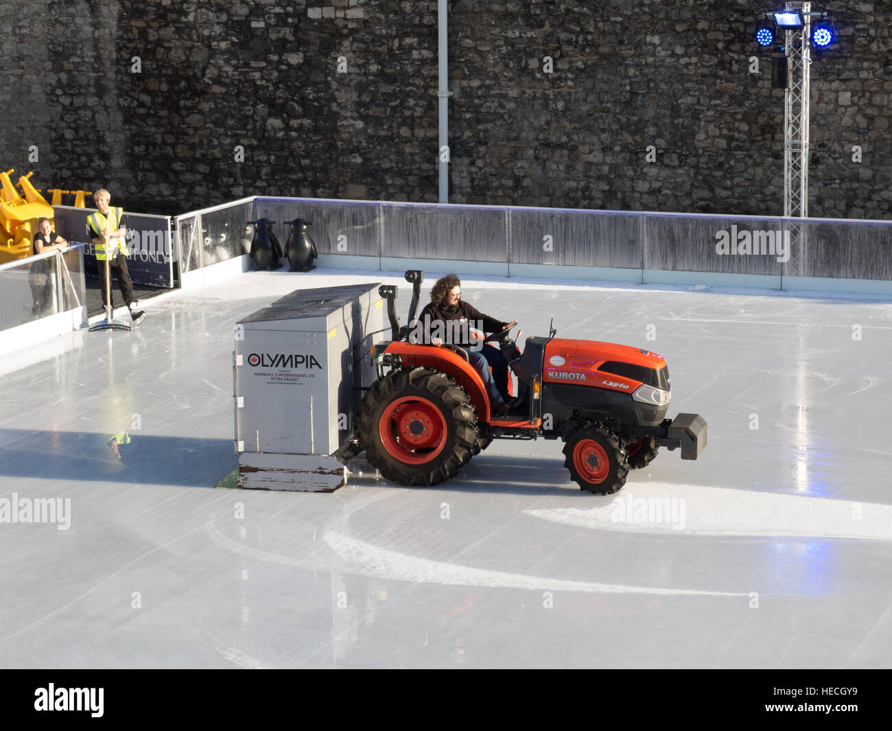 cleaning clearing ice rink tractor hopper crisp Stock Photo - Alamy