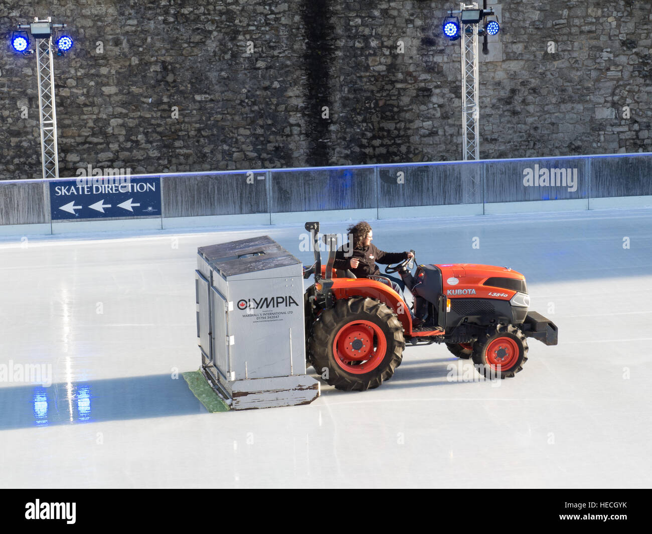 cleaning clearing ice rink tractor hopper crisp Stock Photo - Alamy