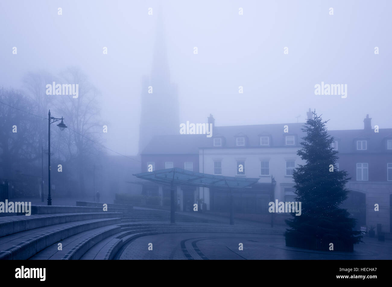 The new market square in Kettering town, England, on a foggy winter day ...