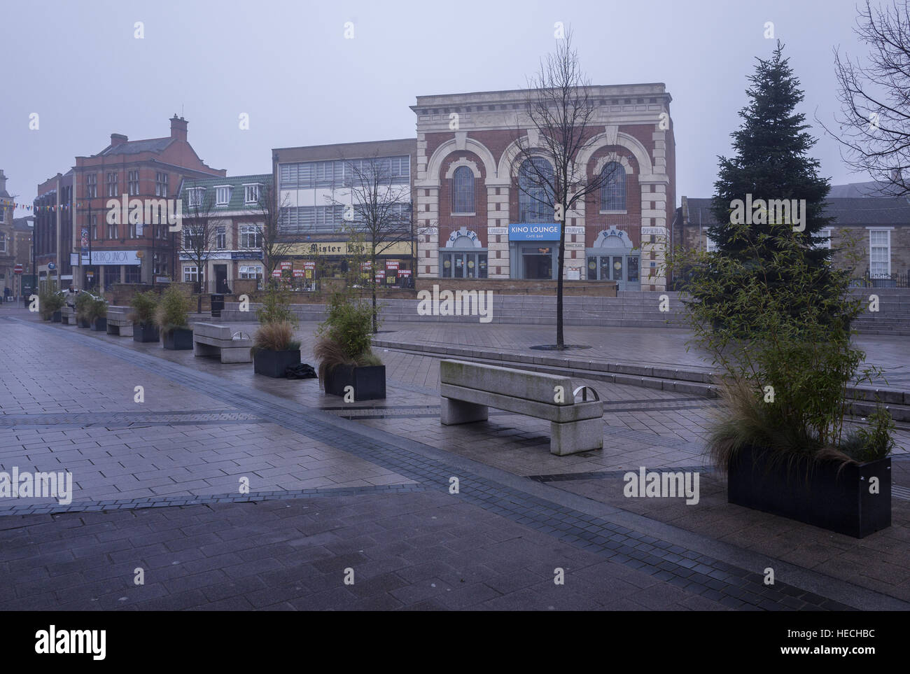 The new market square in Kettering town, England, on a foggy winter day ...