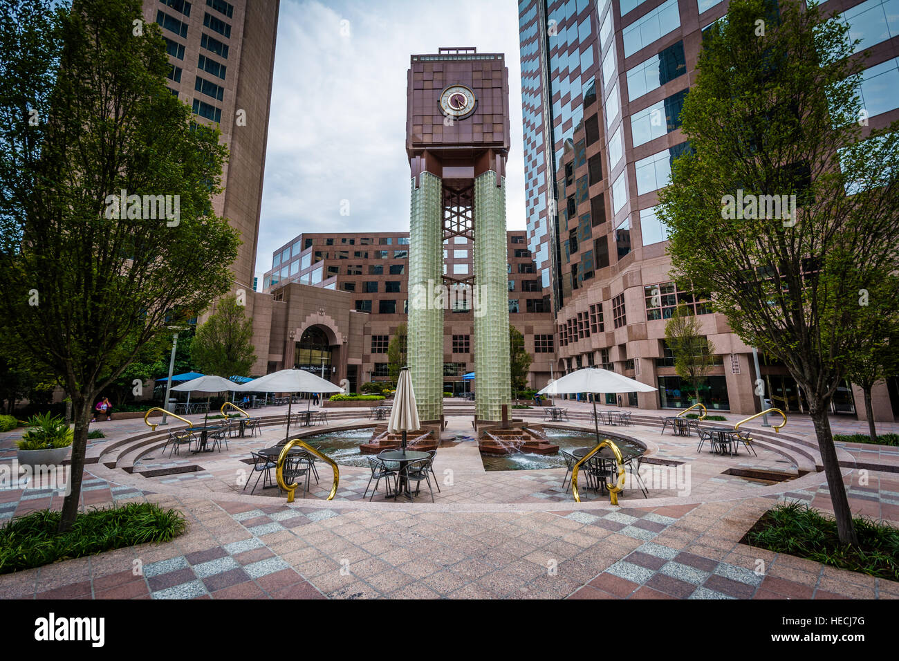 Modern buildings and park with fountain and tables in Uptown Charlotte ...