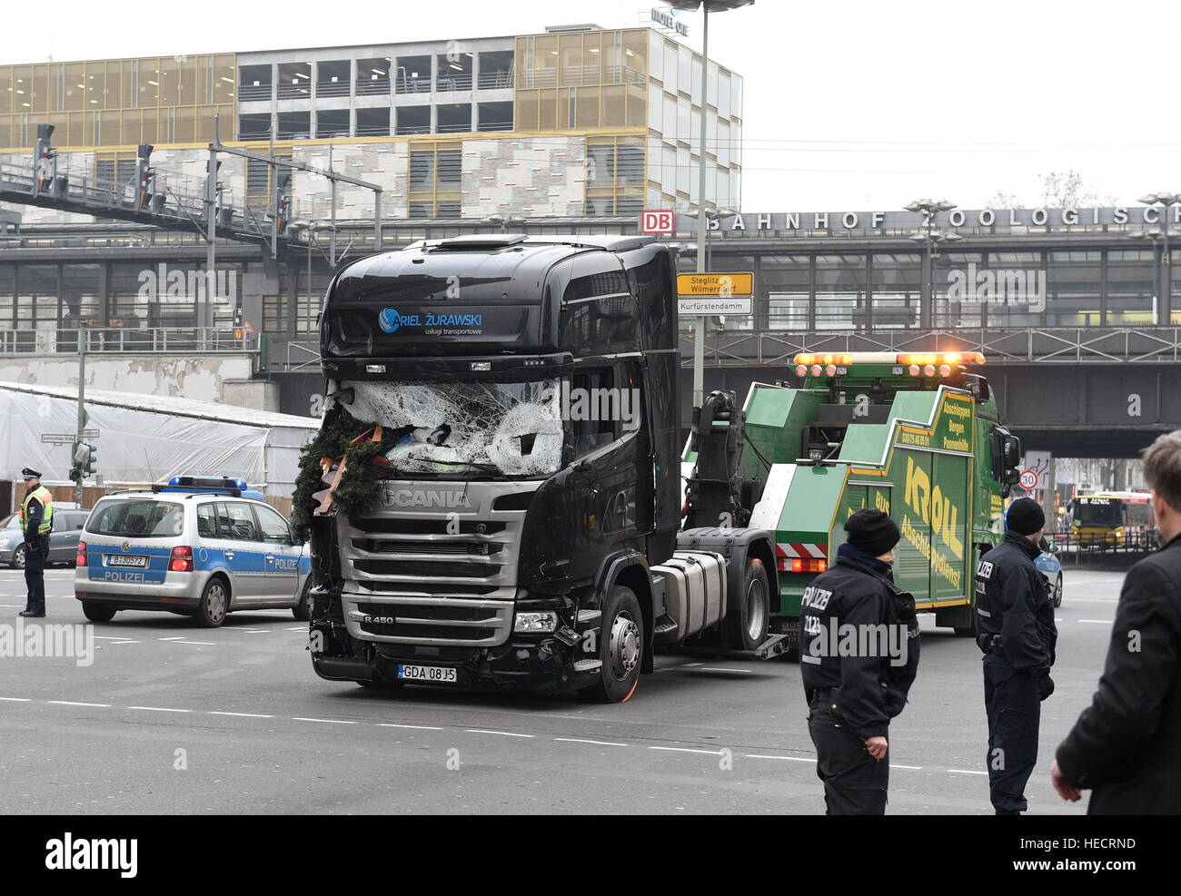 Berlin, Germany. 20th Dec, 2016. A damaged truck is towed away in ...