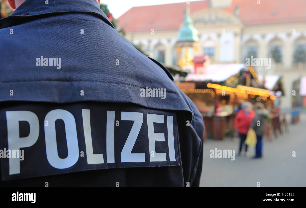 Magdeburg, Germany. 20th Dec, 2016. A police officer at the Christmas ...
