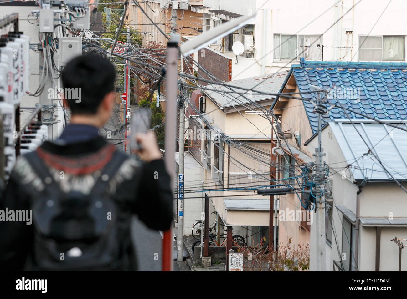 A man takes a pictures of the stairway next to Suga Shrine on December ...