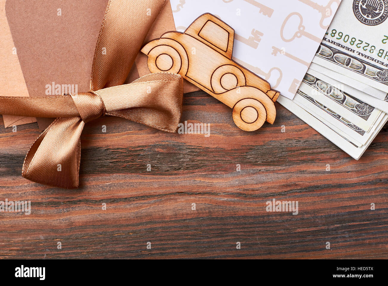 Money and ribbon bow Stock Photo - Alamy