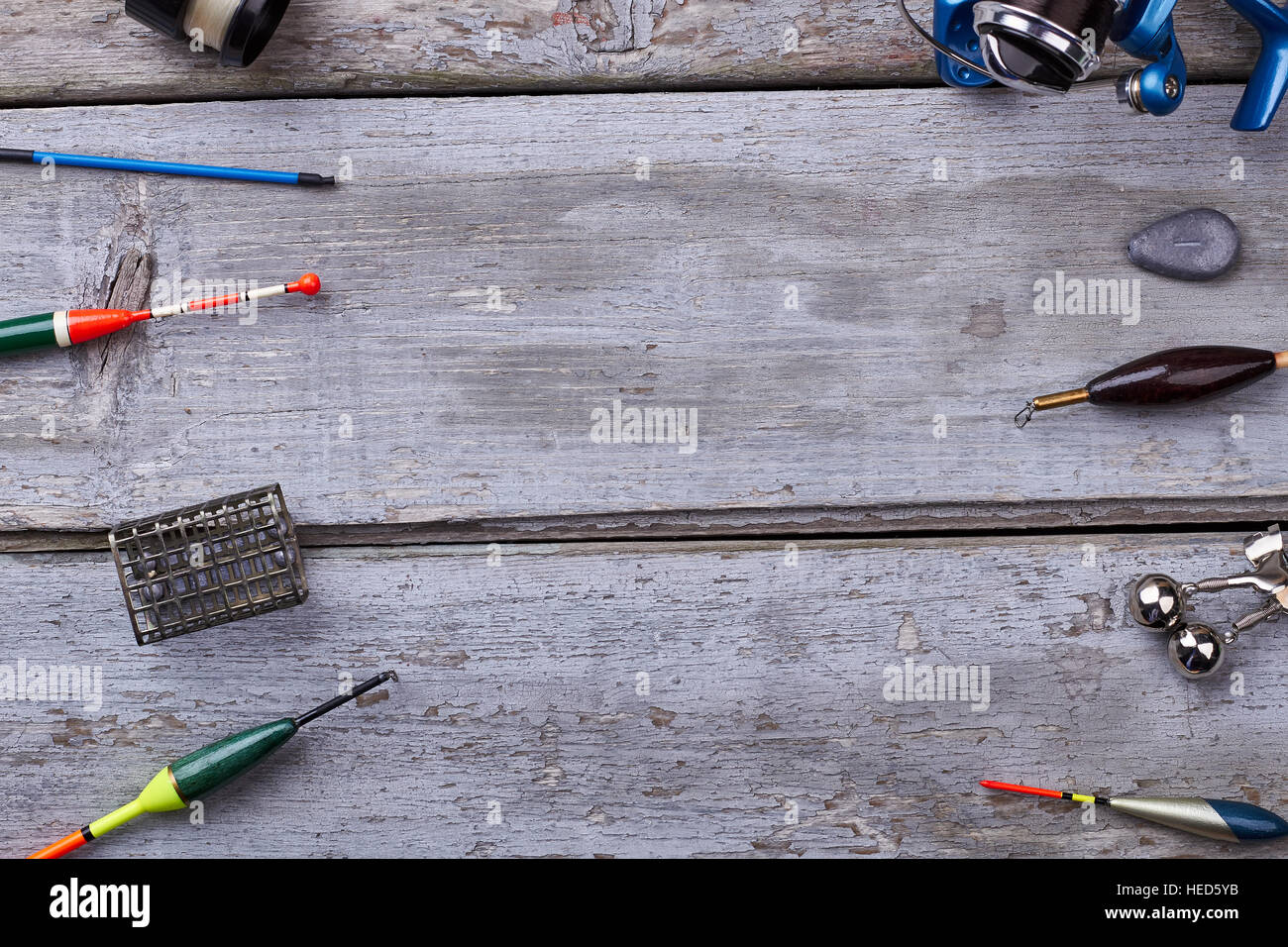 Fishing tackle on wooden background Stock Photo - Alamy