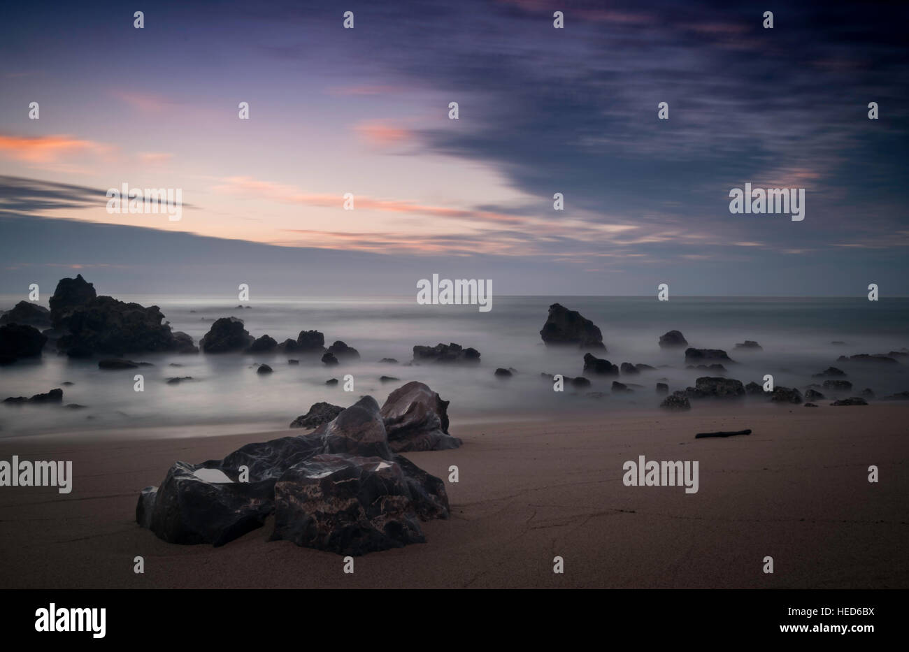Rocks and smooth beach sand hi-res stock photography and images - Alamy