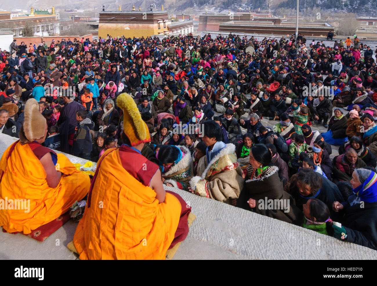 Xiahe: Tibetan Monastery Labrang at the Monlam Festival; 2 higher monks ...