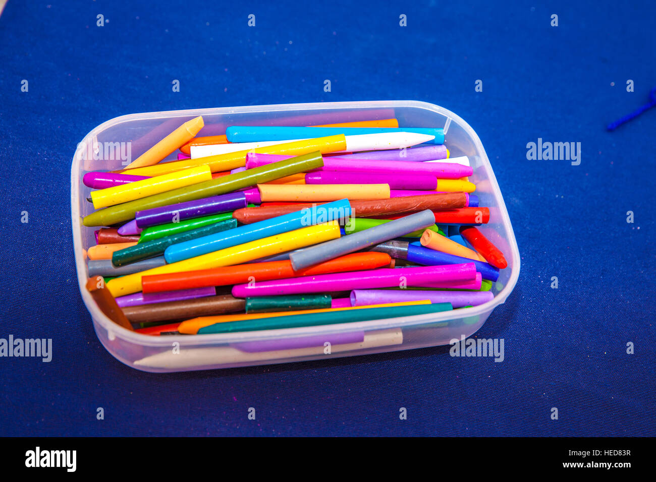 box full of colored crayons on a blue table Stock Photo - Alamy box full of colored crayons on a blue table Stock Photo - Alamy