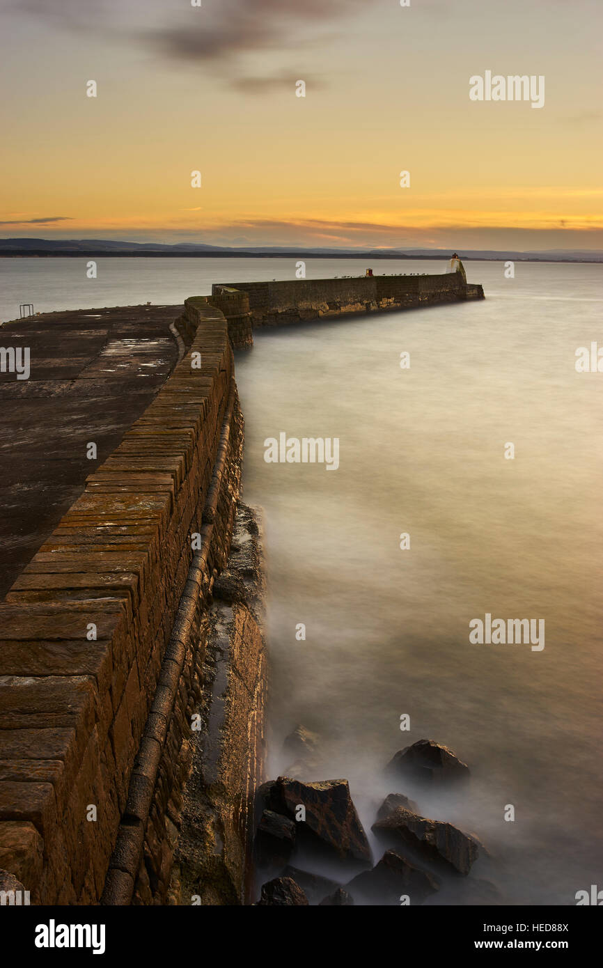Sea wall at Burghead harbour, Moray, Scotland at sunset Stock Photo - Alamy
