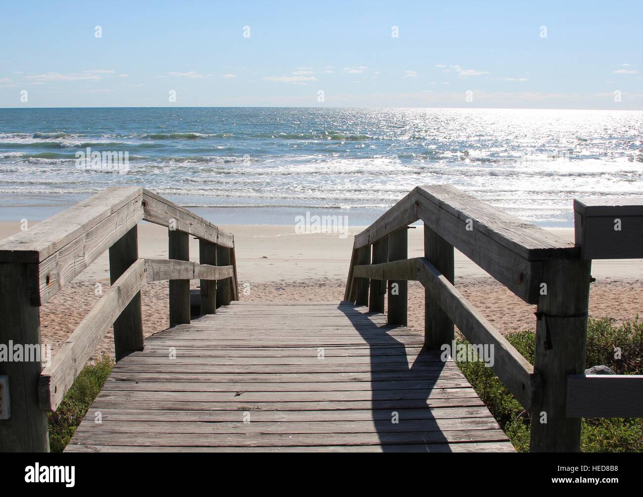 The pier walkway to the ocean Stock Photo - Alamy