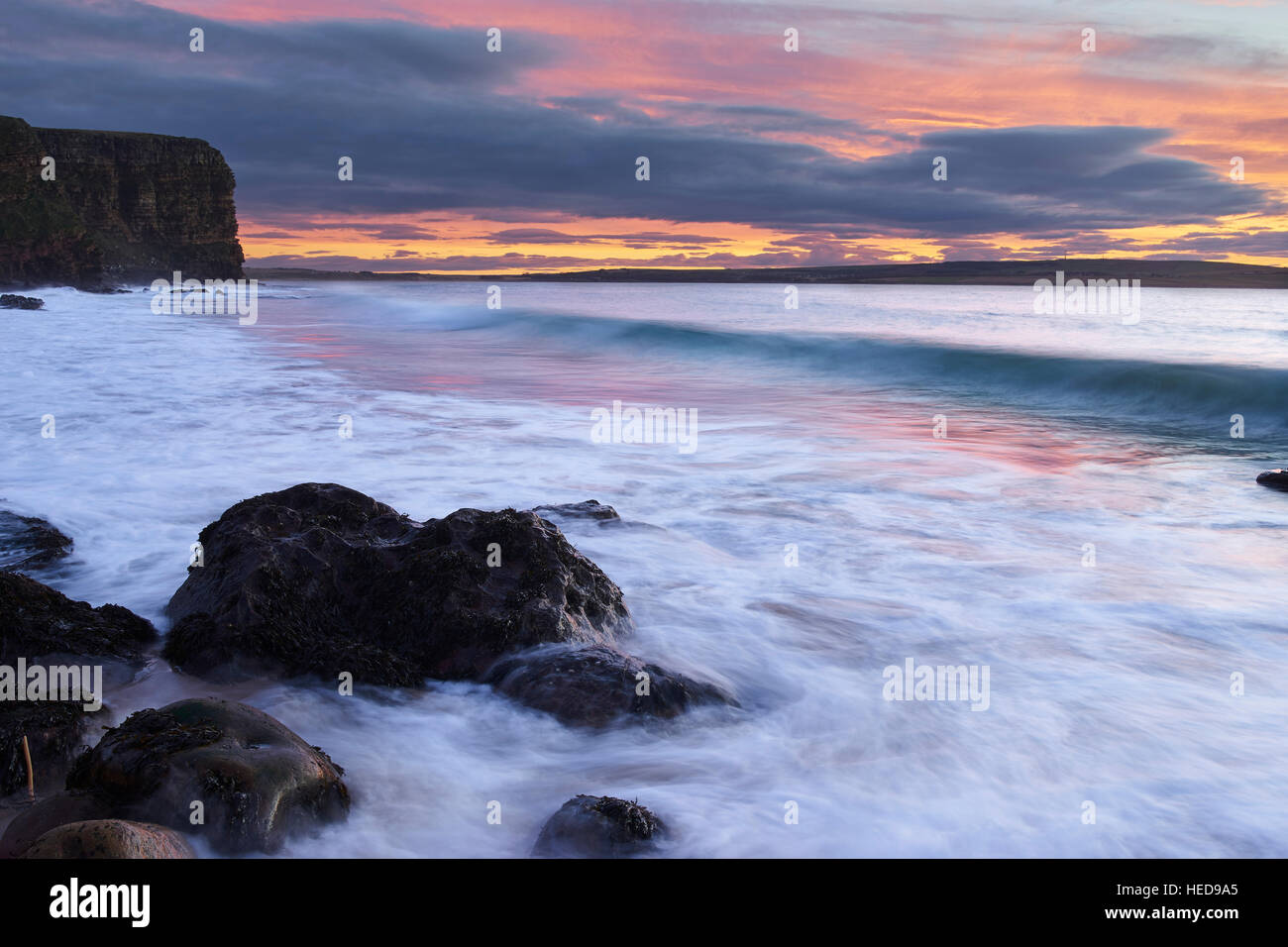 Boulders on Peedie Beech, Dunnet, Caithness, Scotland. At sunset with ...