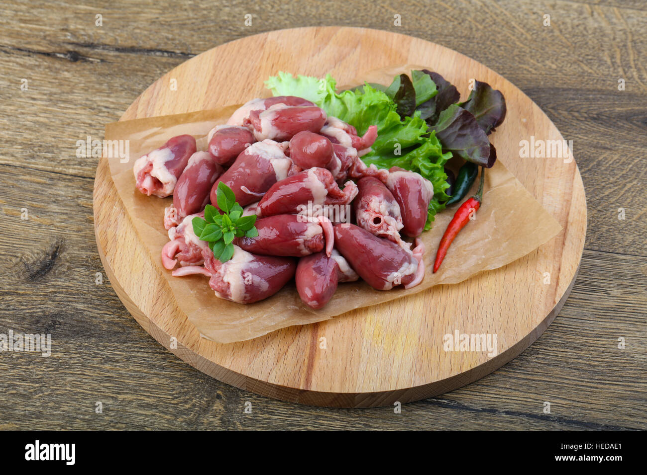 Raw chicken hearts on the plate ready for cooking Stock Photo - Alamy