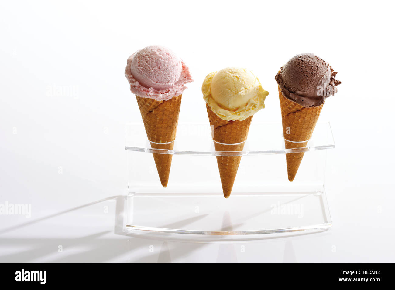 Three ice-cream cones in a stand Stock Photo - Alamy