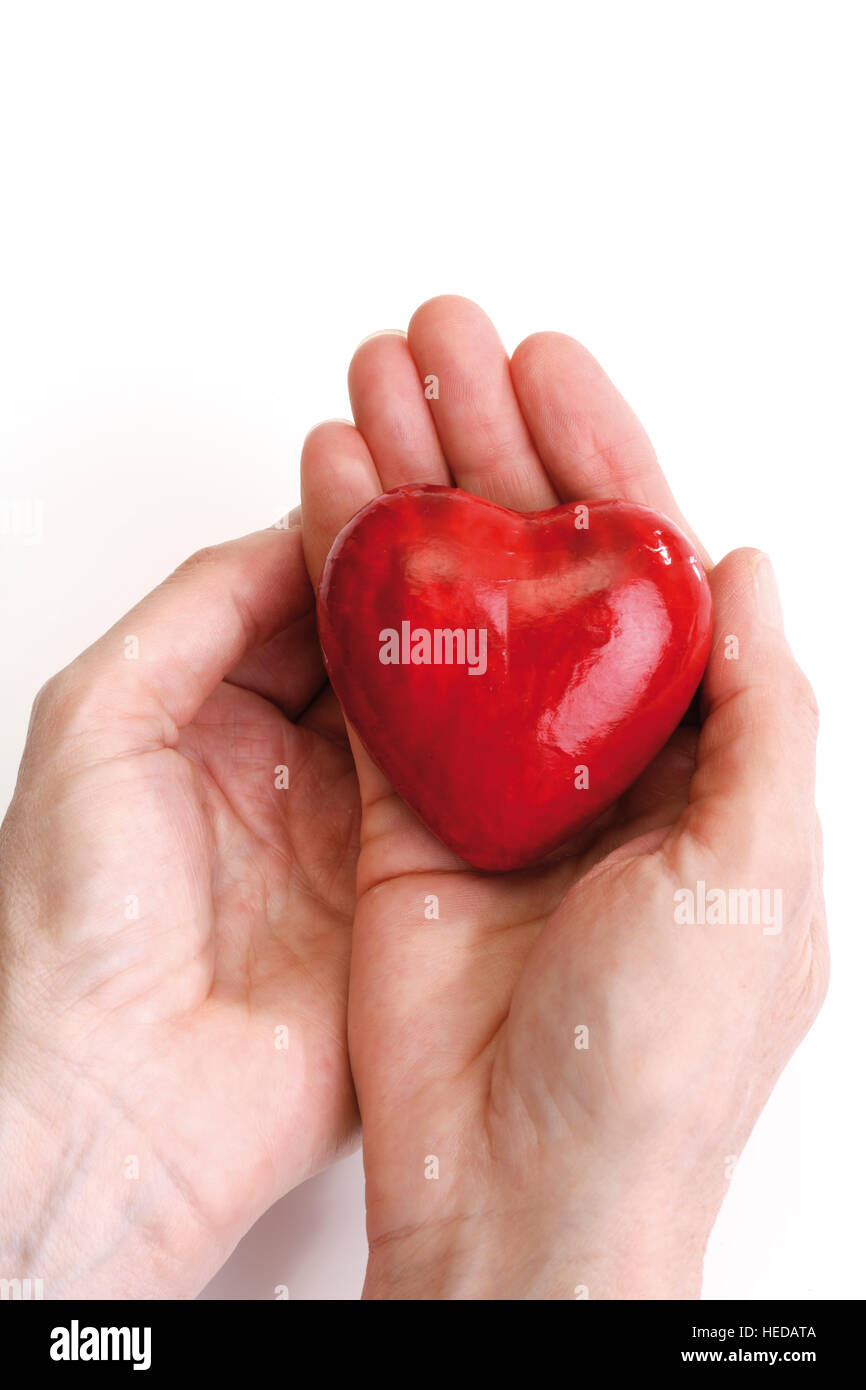 Hands holding a heart Stock Photo - Alamy