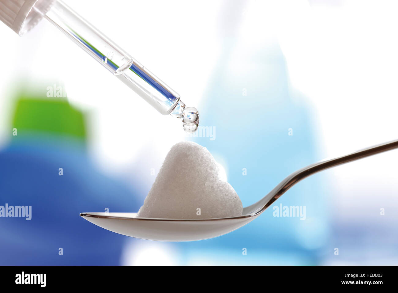 Dropping homeopathic medicine onto a spoonful of sugar on a spoon Stock ...