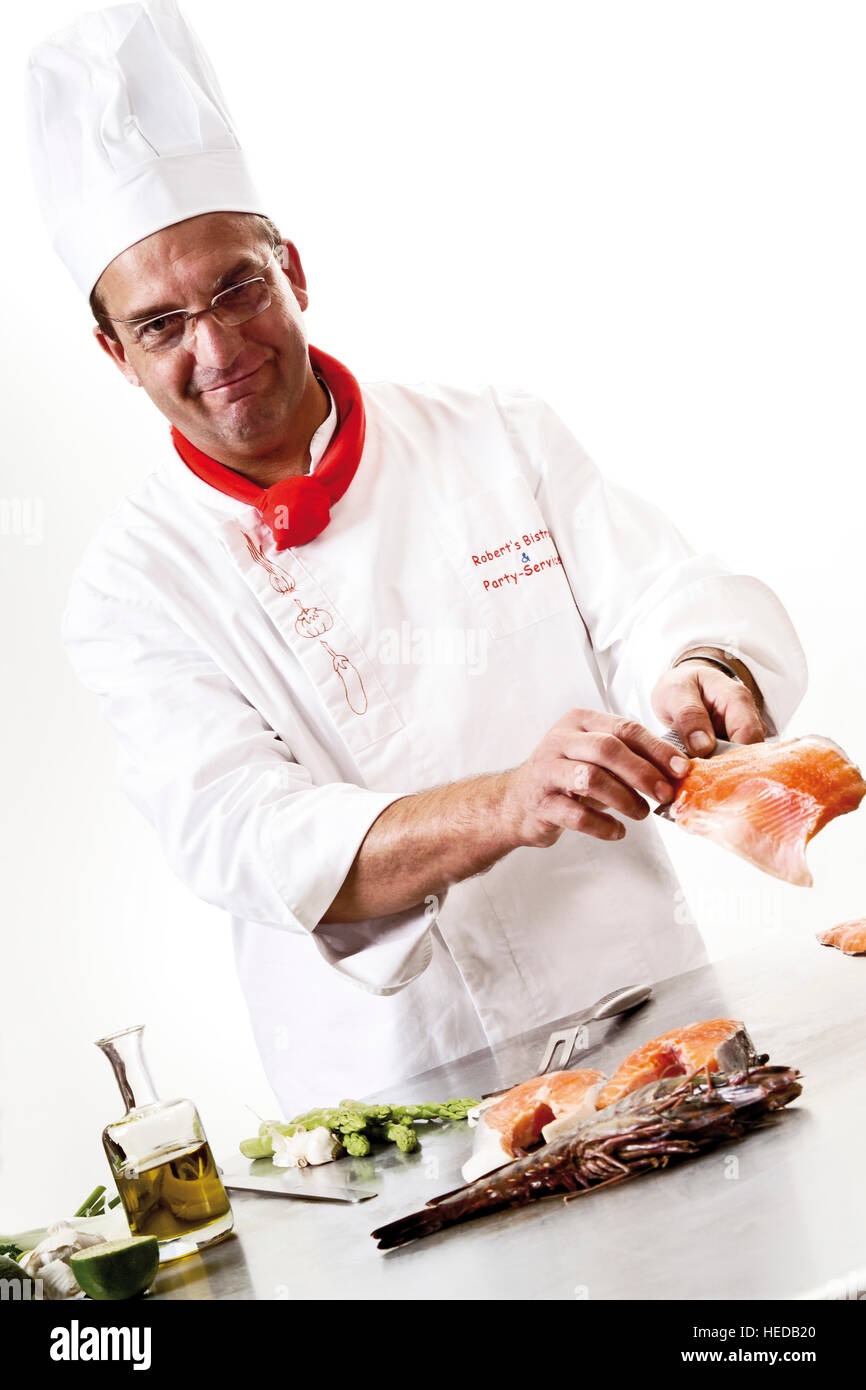 Cook prepares fresh fish hi-res stock photography and images - Alamy