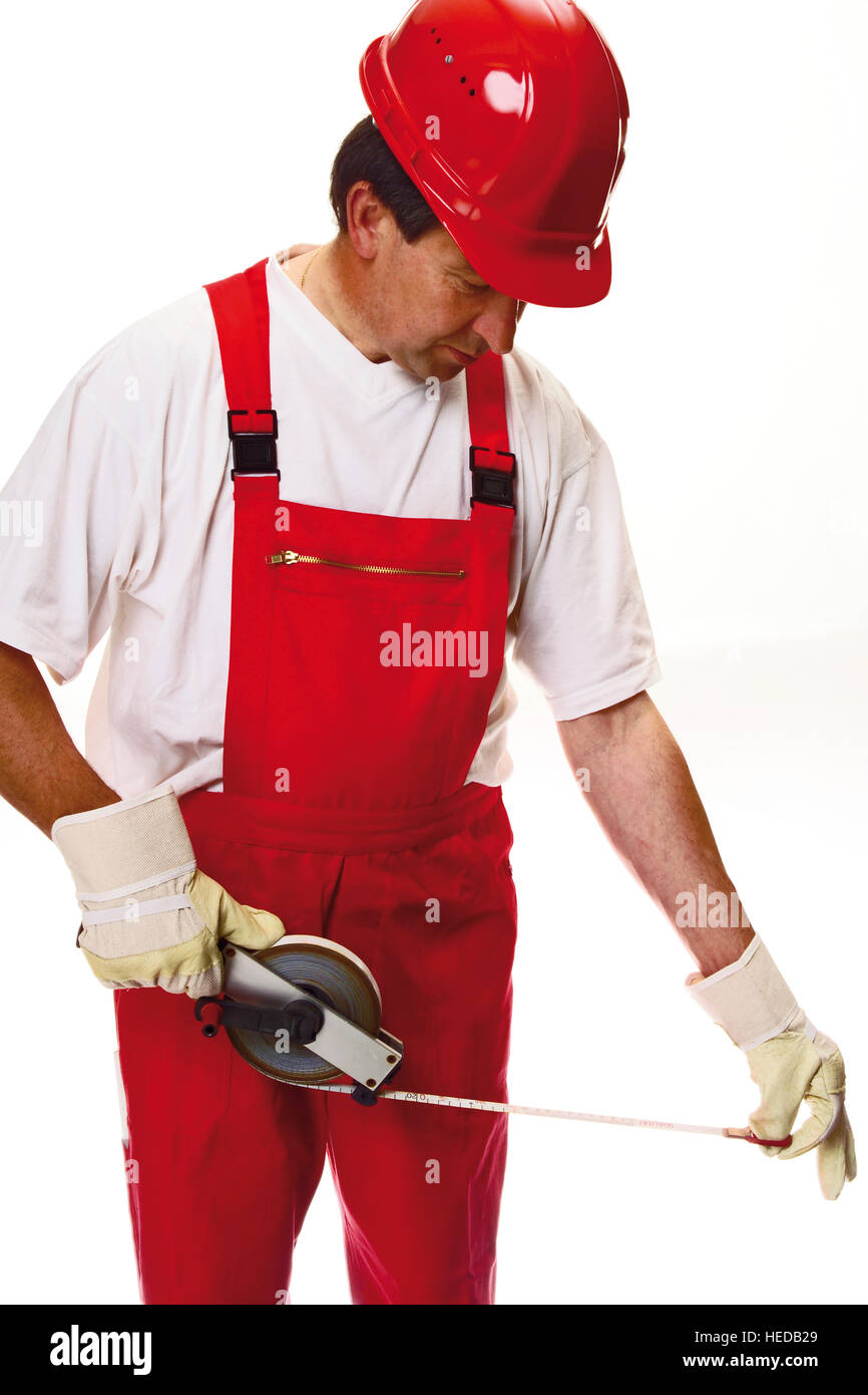 Workman with measuring tape Stock Photo - Alamy