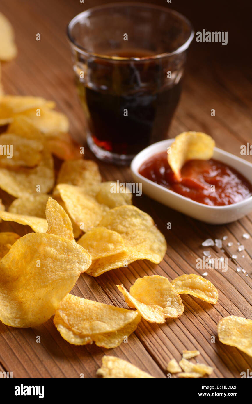 fries with soft drink on the wooden table Stock Photo - Alamy