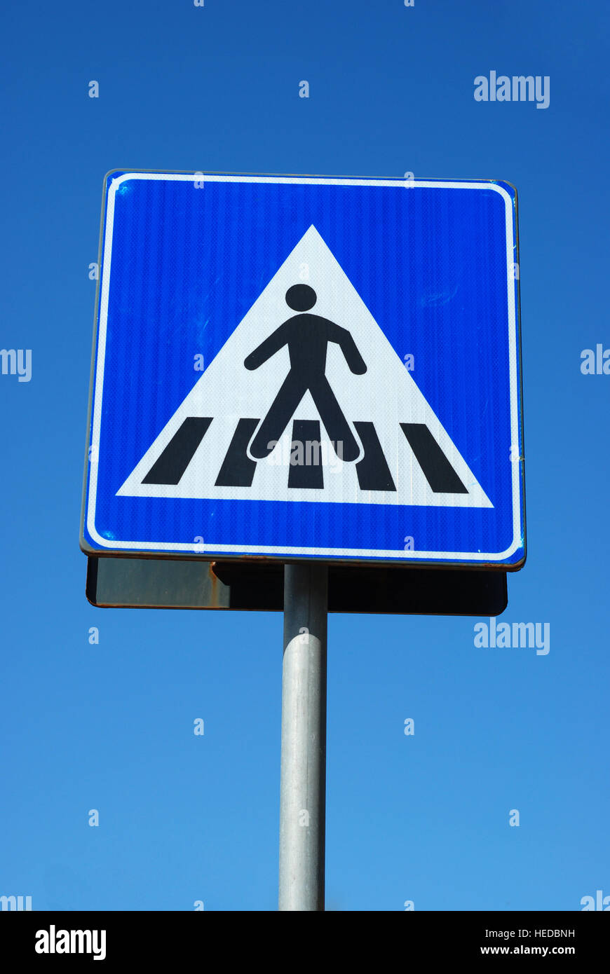 pedestrian sign with the blue sky Stock Photo - Alamy