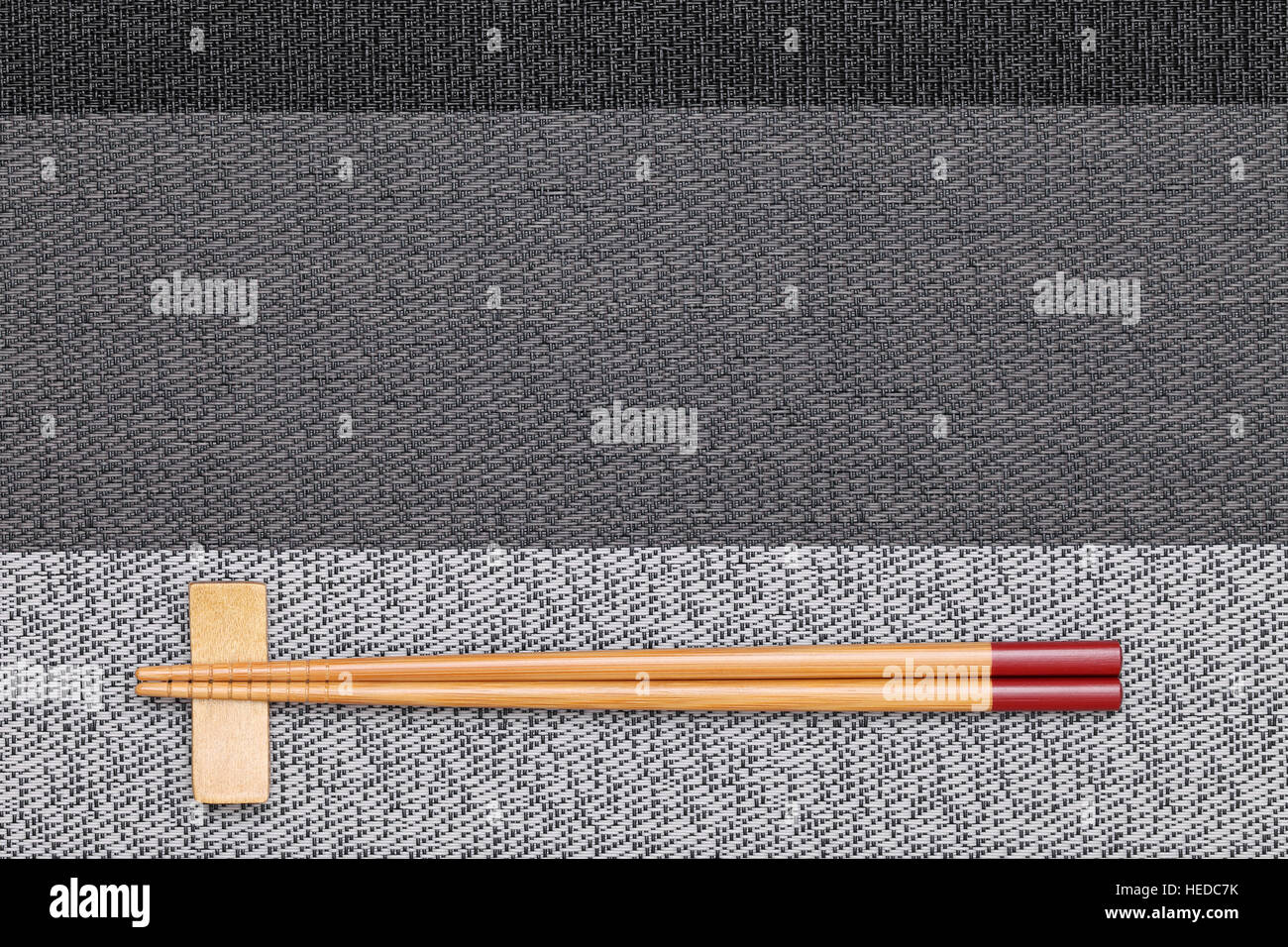 Chopsticks and chopsticks rest on table background Stock Photo - Alamy