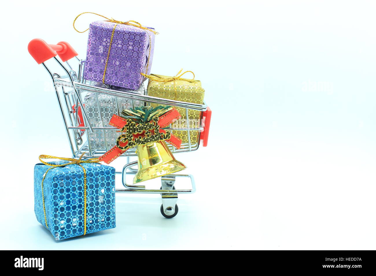 shopping cart with colorful four gift boxs and golden bell for use in ...
