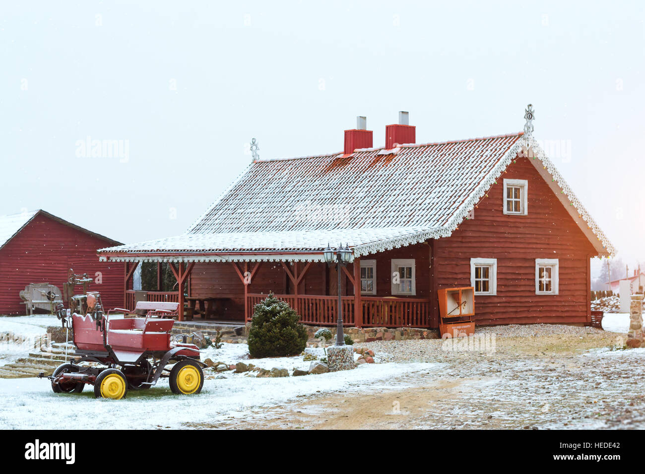 Lithuanian countryside, snowy winter. Baltic rustic architecture with ...