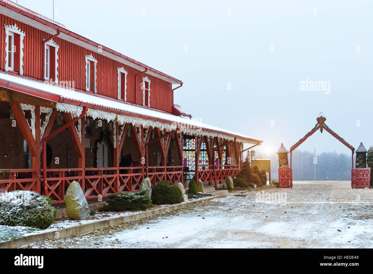 Lithuanian countryside, snowy winter. Baltic rustic architecture with ...