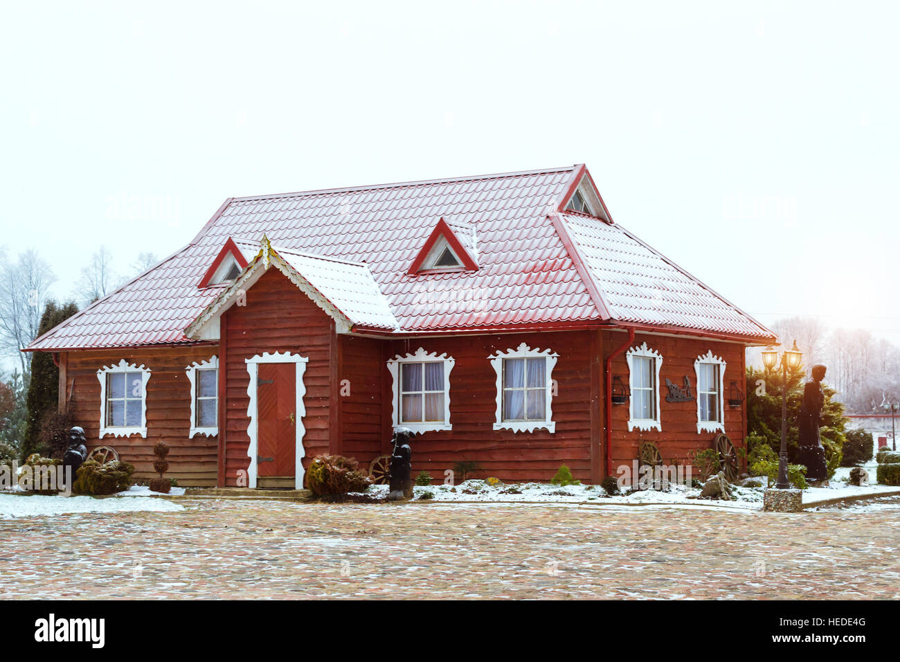 Lithuanian countryside, snowy winter. Baltic rustic architecture with ...