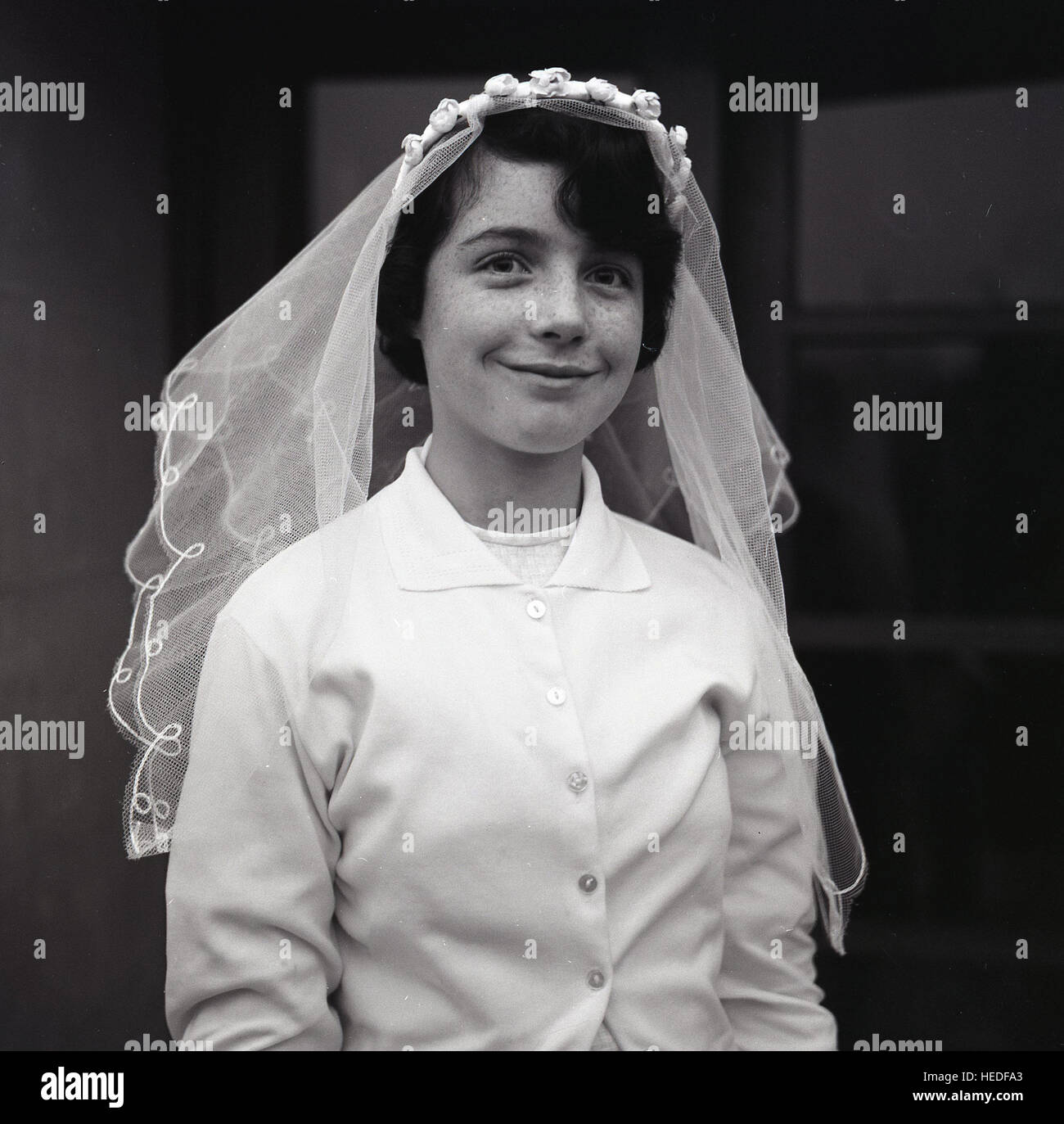 1960s, historical, young female wearing religious head covering or veil ...