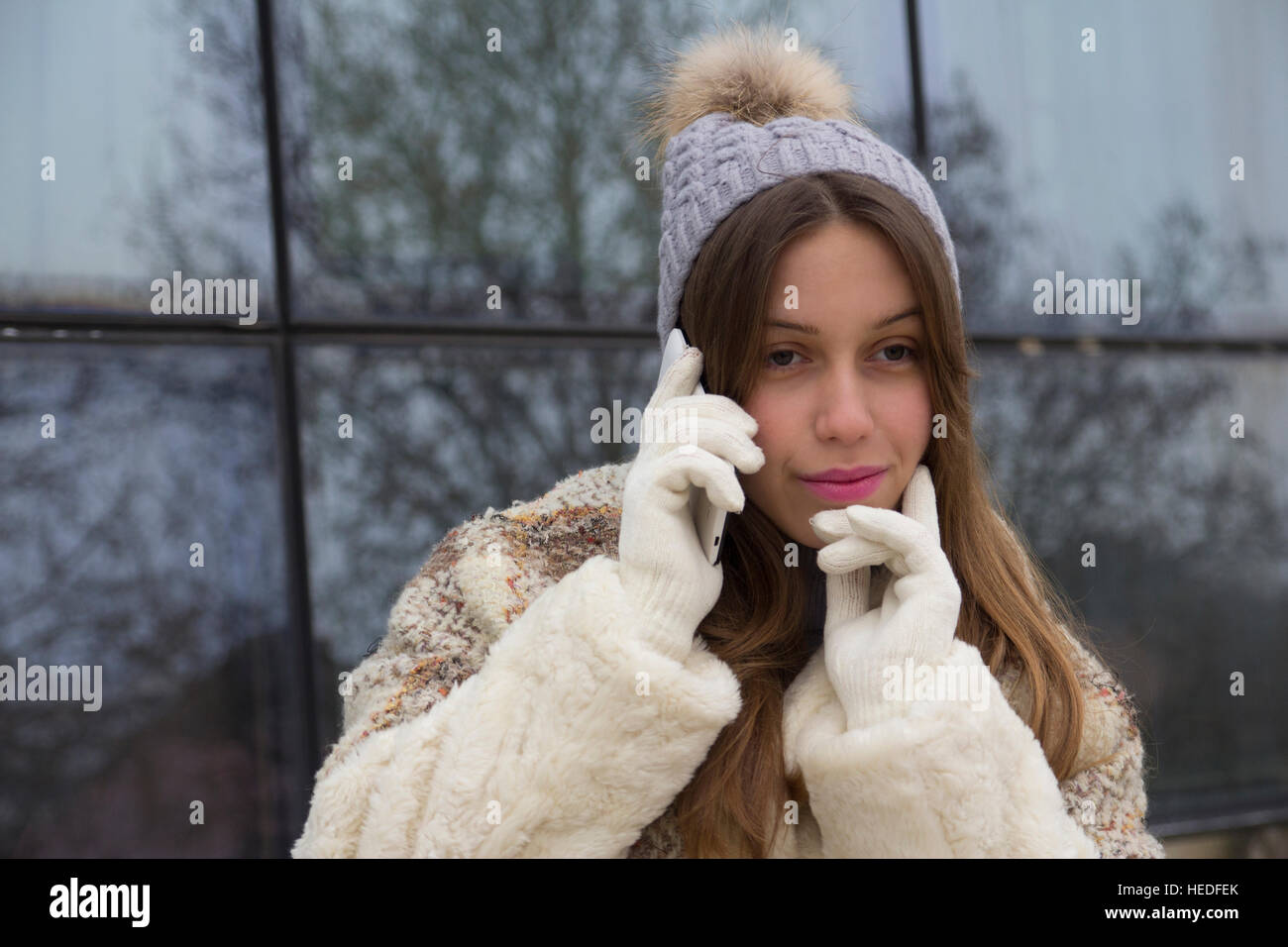 Young woman phoning with a mobile phone Stock Photo - Alamy