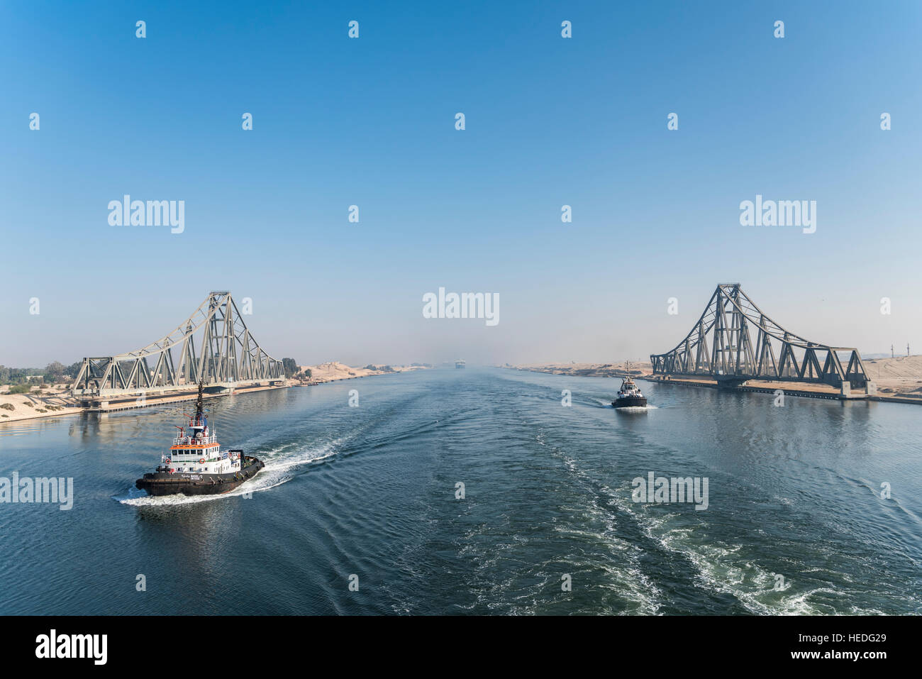 Tug Boat passes El Ferdan Railway Bridge in the Suez Canal near ...