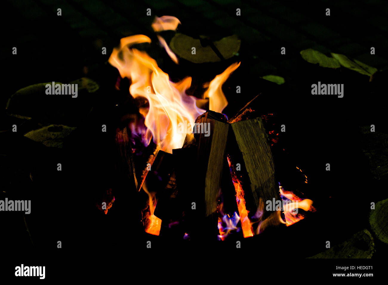 fire in fireplace and flames dance outside night Stock Photo - Alamy