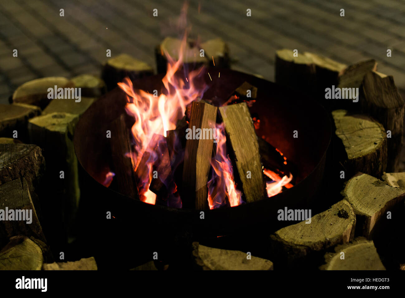 fire in fireplace and flames dance outside night Stock Photo - Alamy