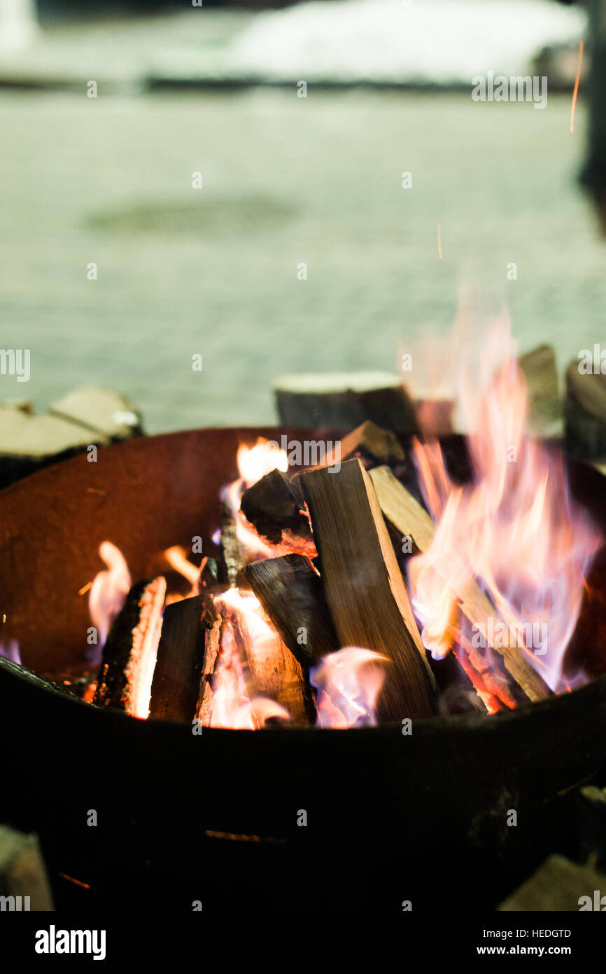fire in fireplace and flames dance outside night Stock Photo - Alamy