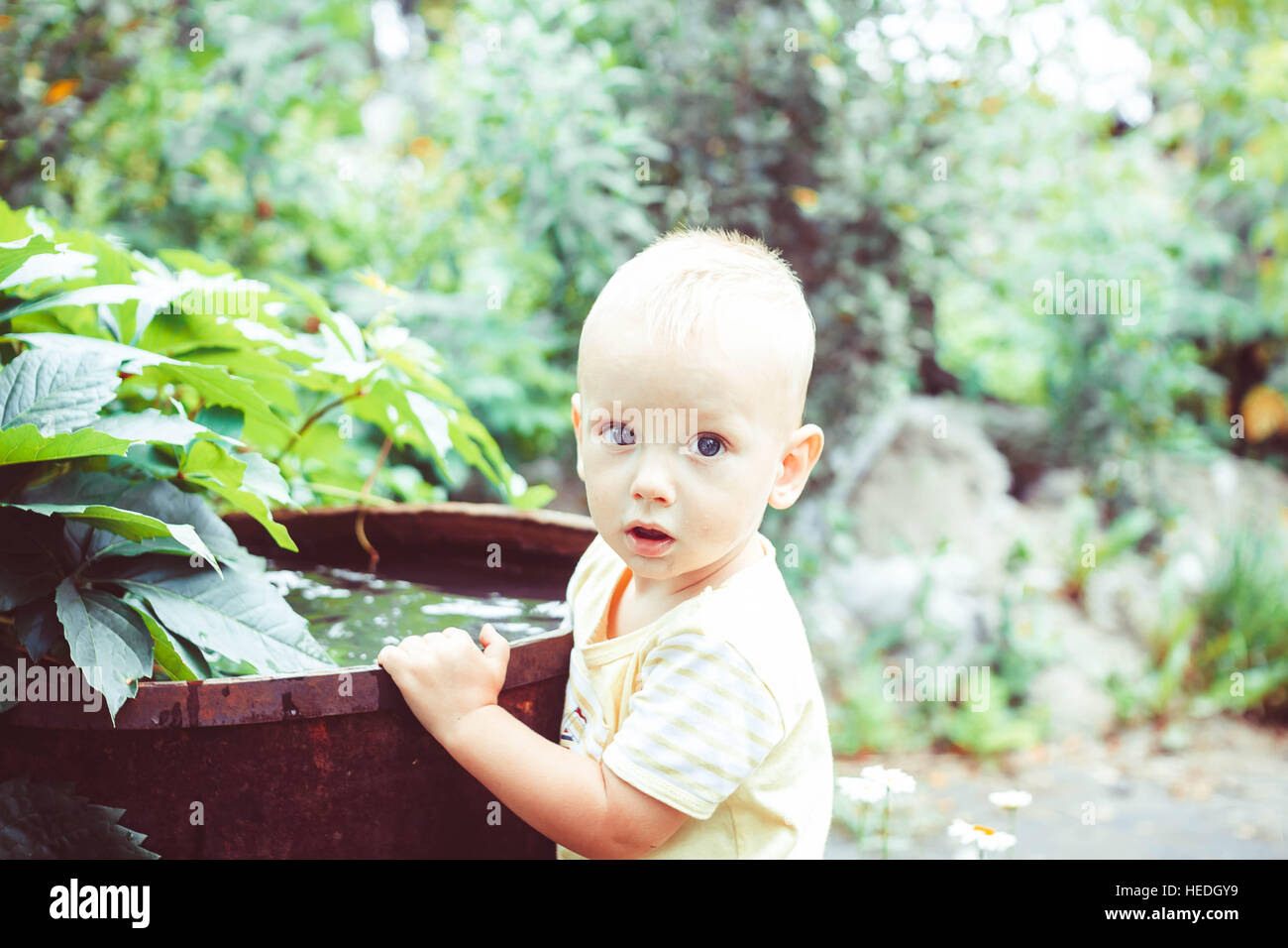 child plays with water Stock Photo - Alamy