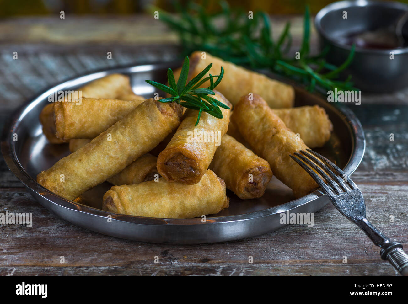 Fried Chinese duck spring rolls and sweet chili dip Stock Photo - Alamy
