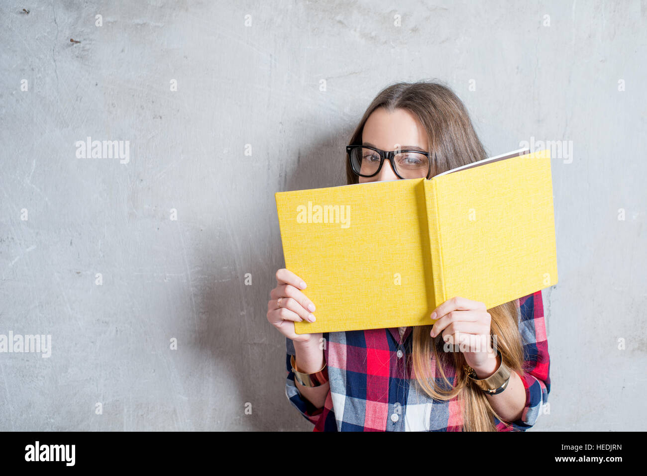 Student portrait on the wall background Stock Photo - Alamy