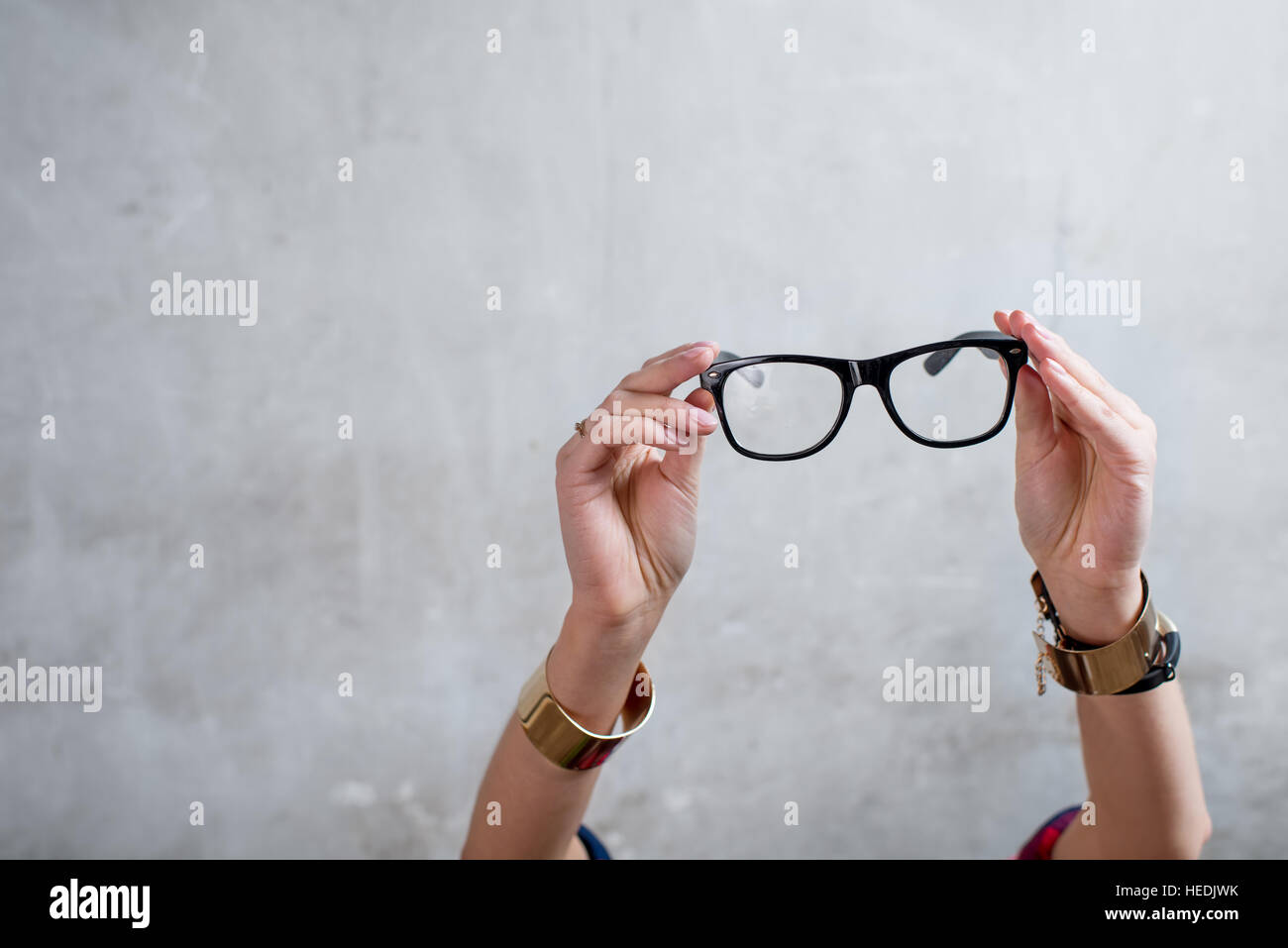 Eyeglasses on the wall background Stock Photo - Alamy