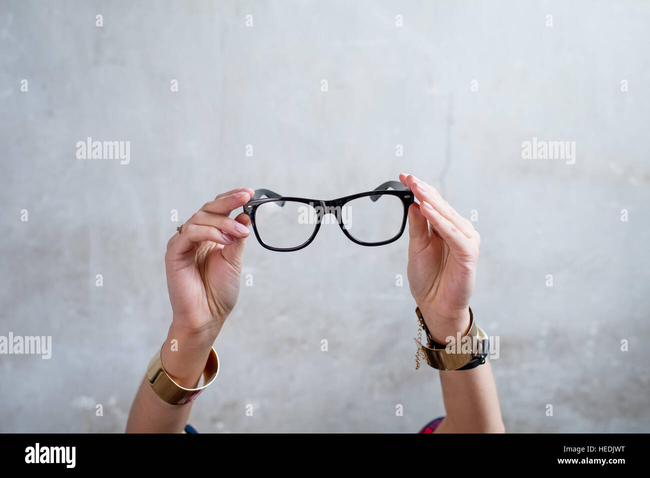 Eyeglasses on the wall background Stock Photo - Alamy