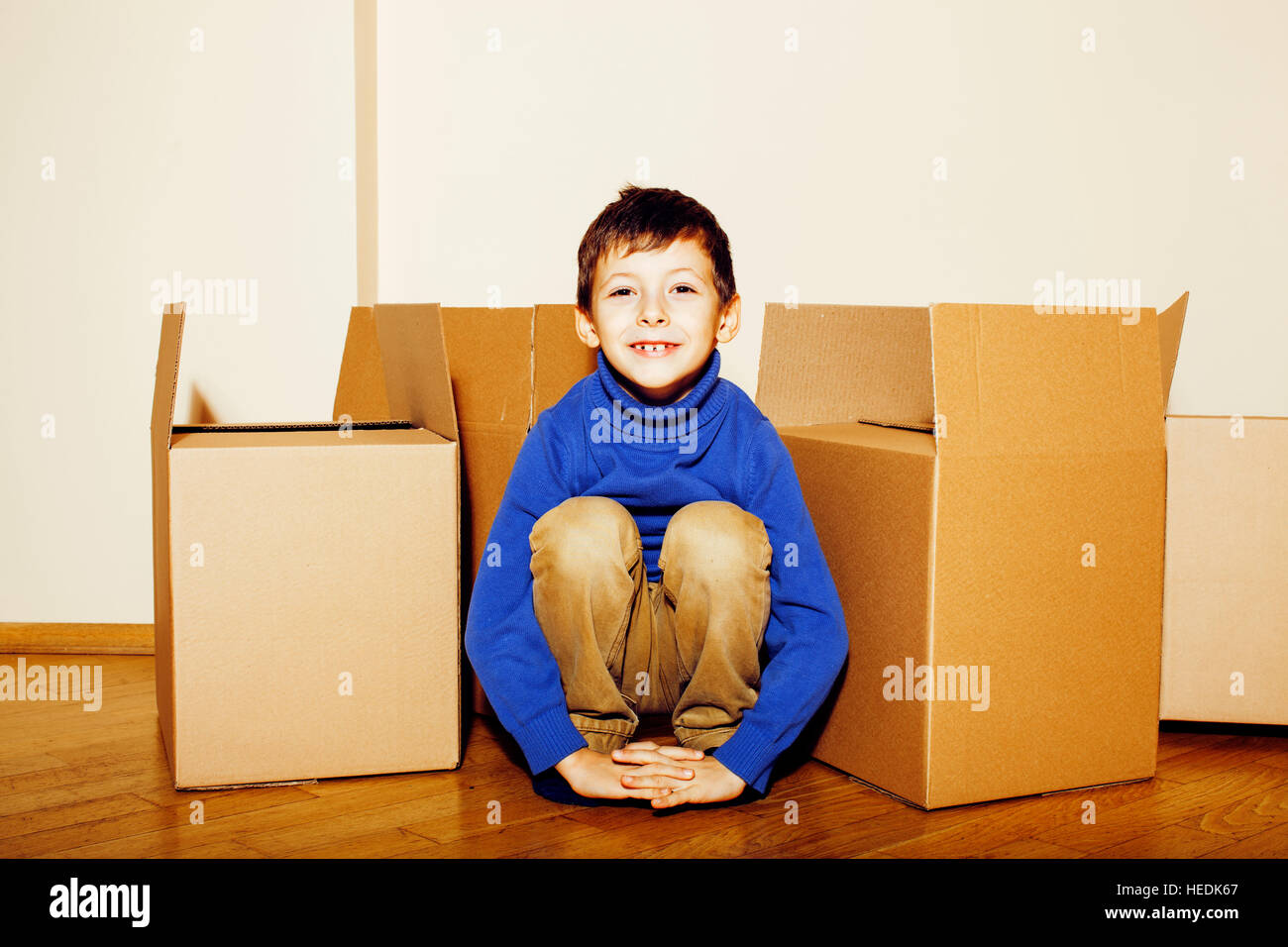 little cute boy in empty room, remoove to new house. home alone ...